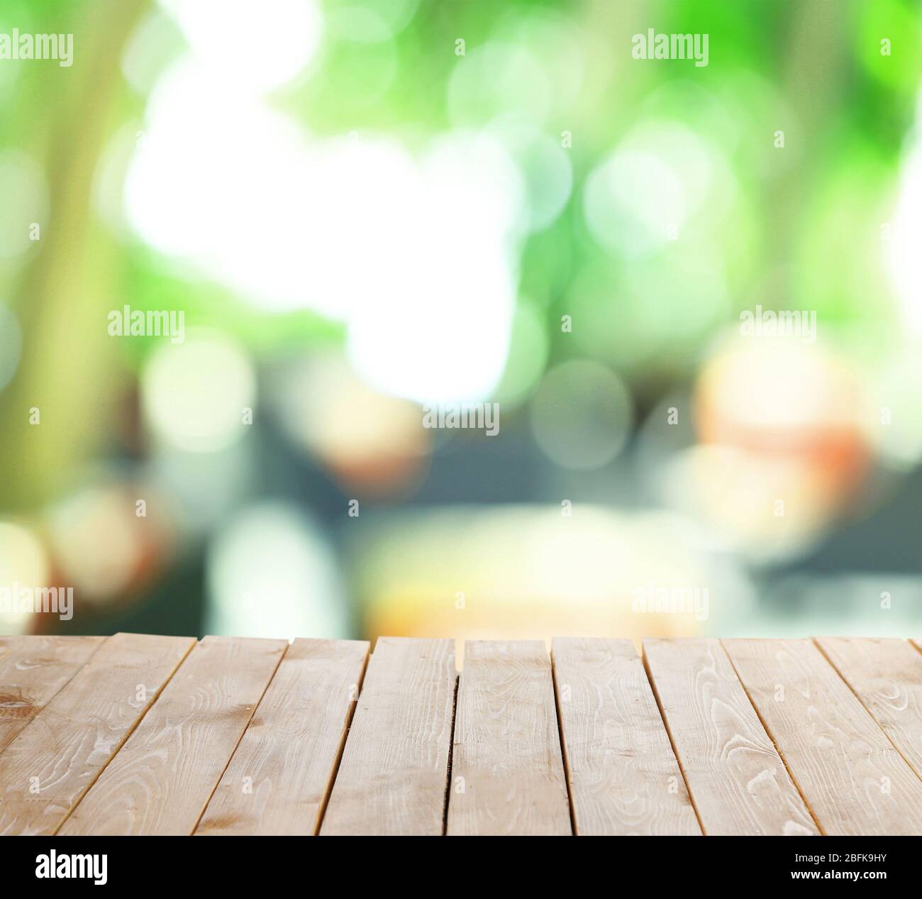 Wooden table with abstract blur background Stock Photo - Alamy