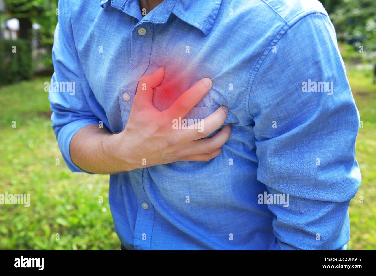Man having chest pain - heart attack, outdoors Stock Photo - Alamy