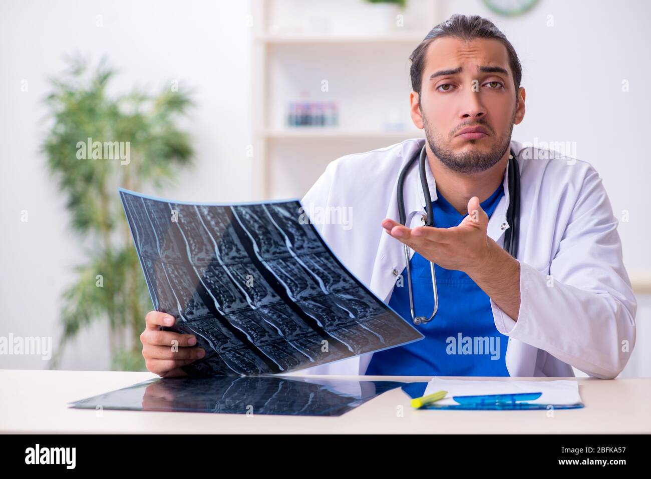 Young doctor being tired after night shift Stock Photo - Alamy
