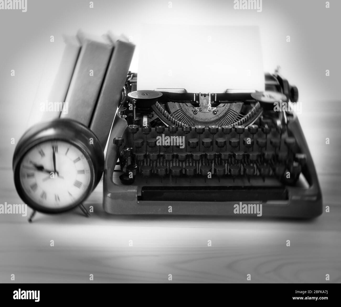 Vintage Typewriter and clock on table Stock Photo - Alamy