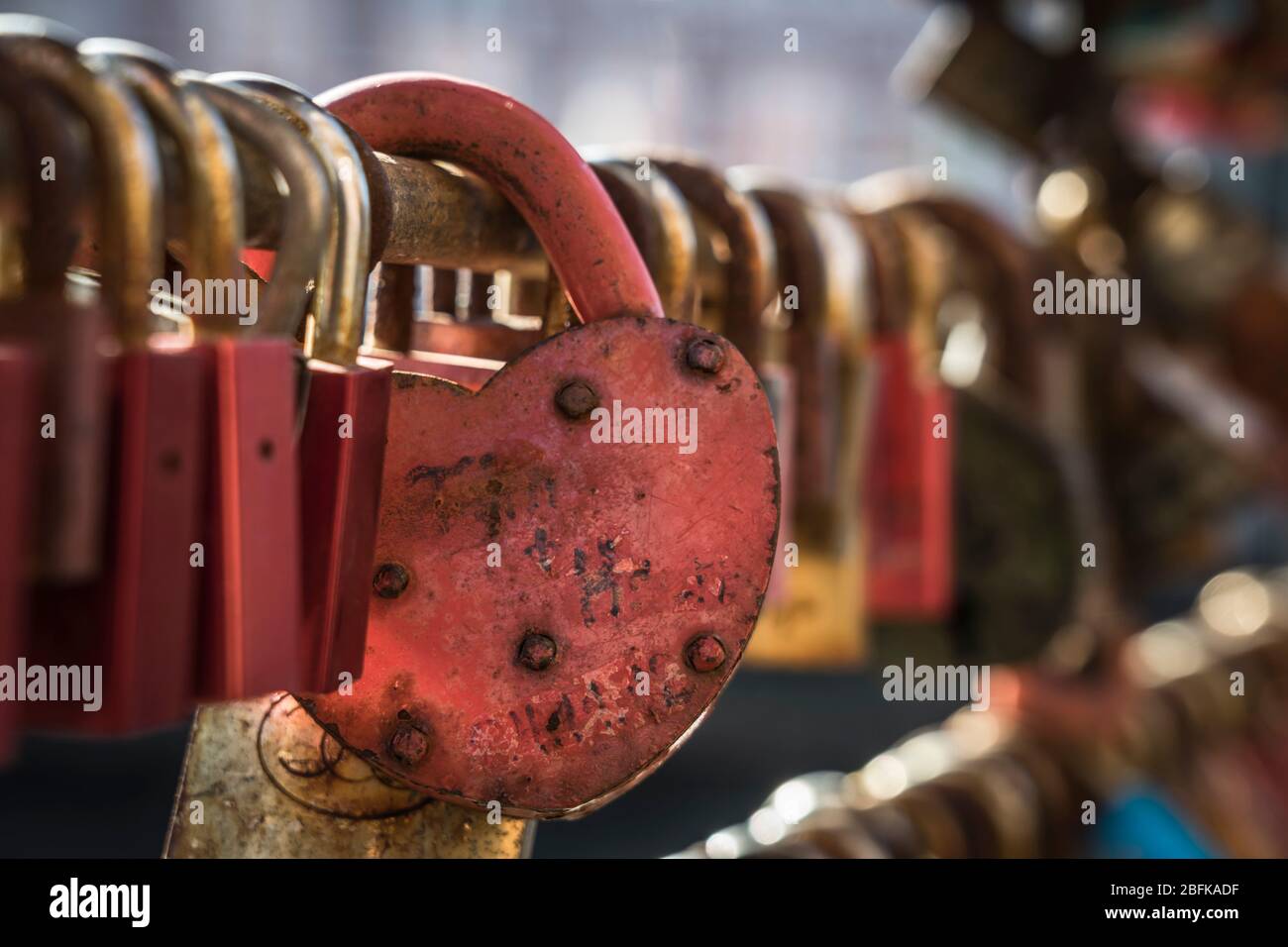 Love padlocks on a bridge rail Stock Photo - Alamy