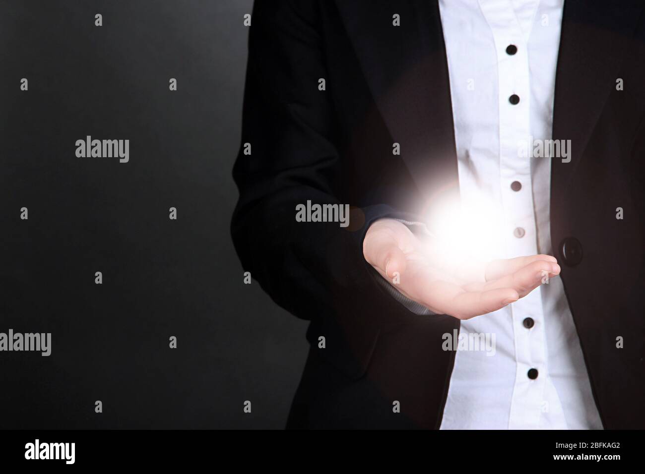 The light in young woman hand Stock Photo - Alamy