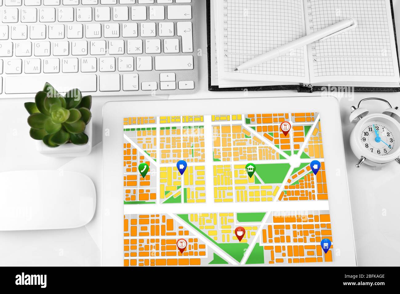 Office workplace. Tablet with map gps navigation application, close-up ...