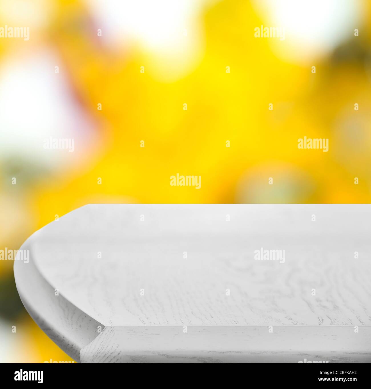 Wooden table with abstract blur background Stock Photo - Alamy