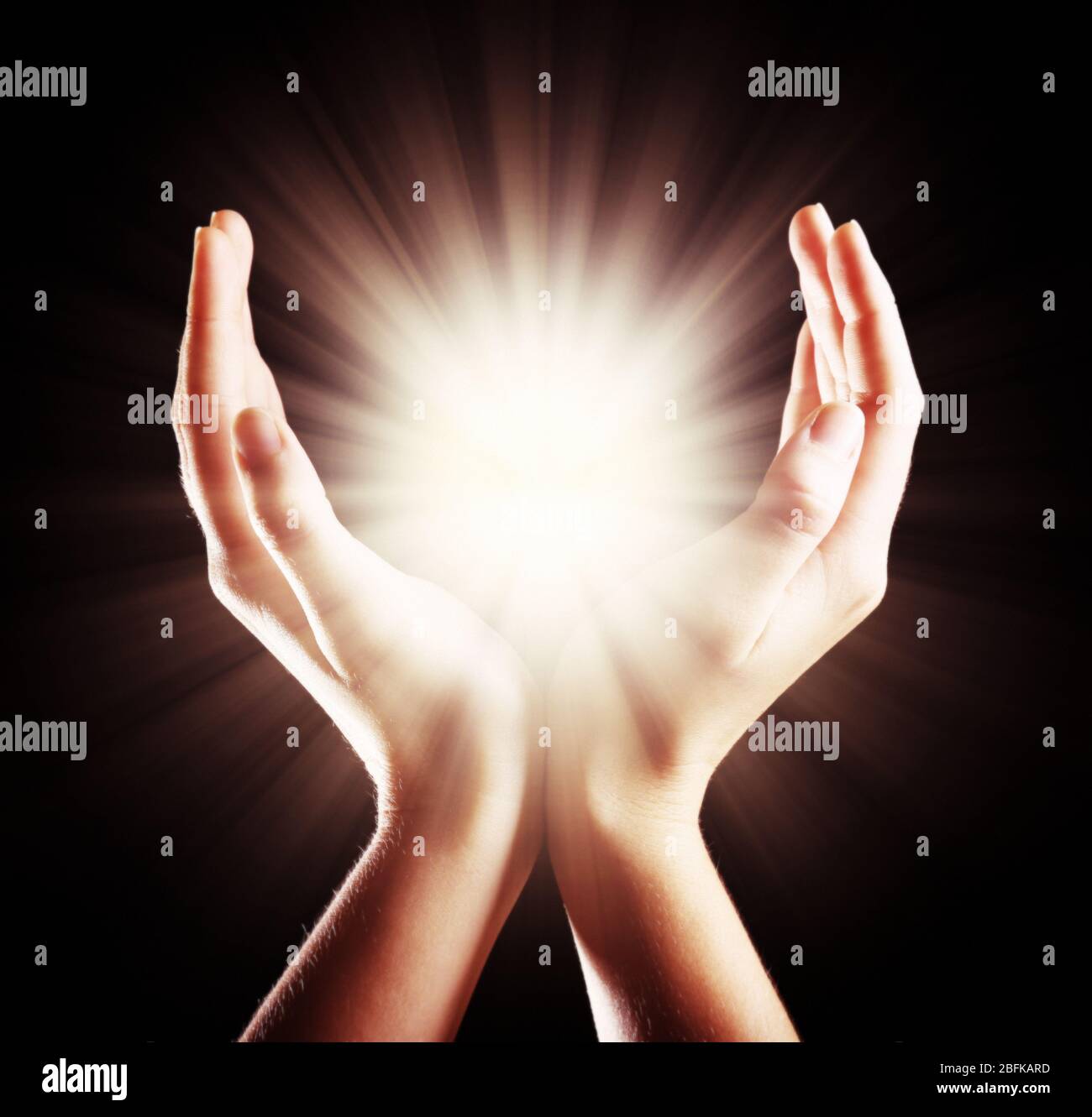 The light in young woman hands Stock Photo - Alamy