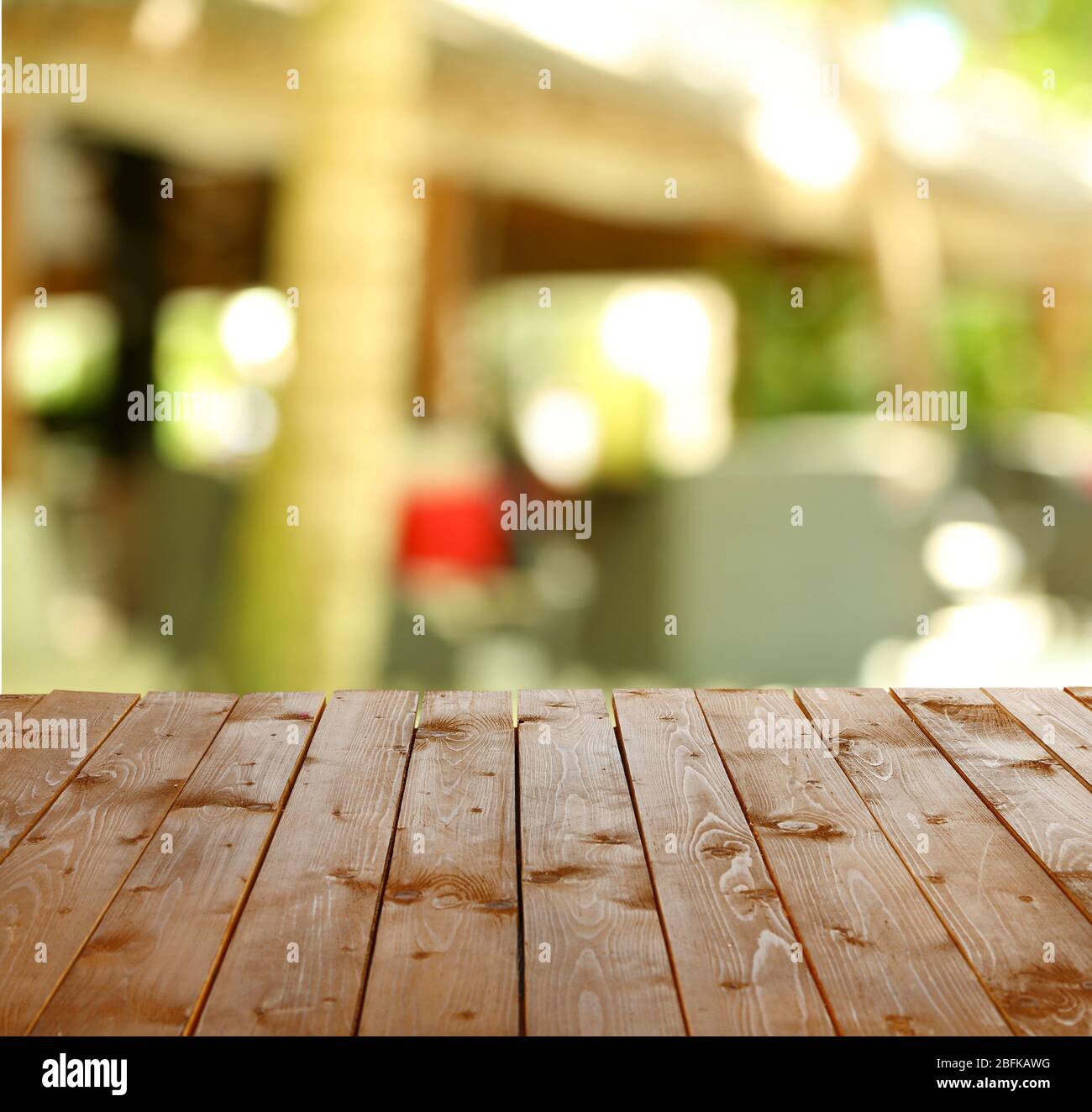 Wooden table with abstract blur background Stock Photo - Alamy