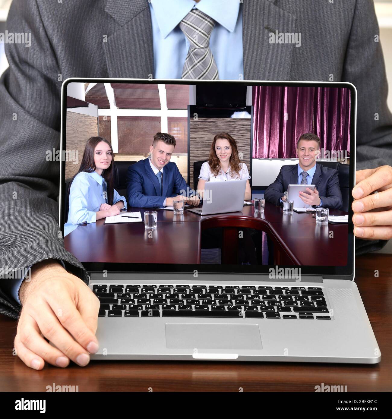 Businesspeople attending video conference hi-res stock photography and ...