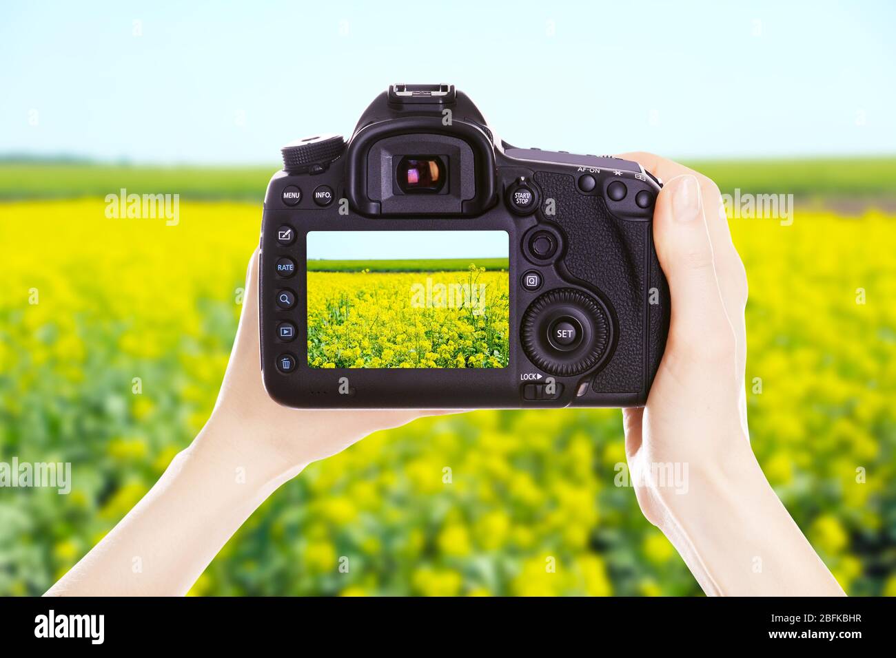 Photographer with camera at work Stock Photo - Alamy