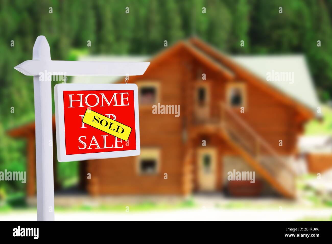 Real estate sign in front of new house for sale Stock Photo - Alamy