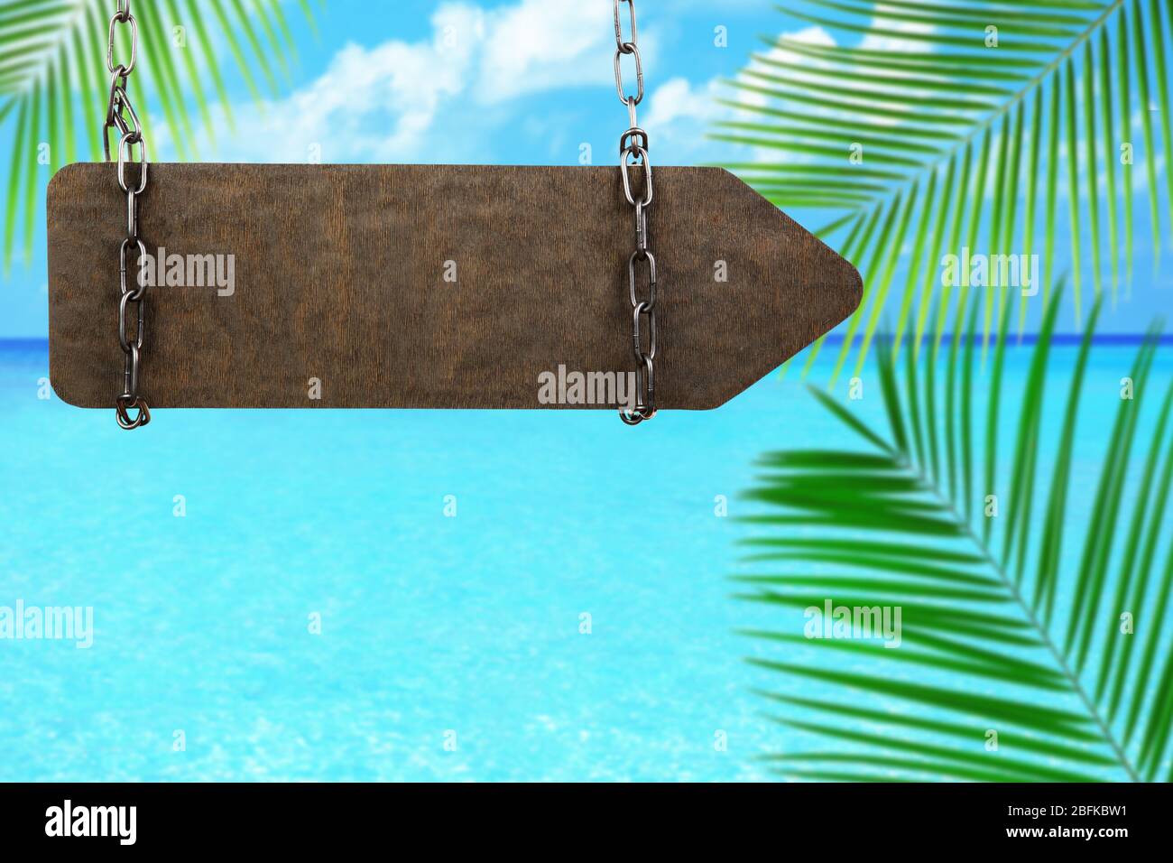 Wooden sign arrow on nature background Stock Photo - Alamy