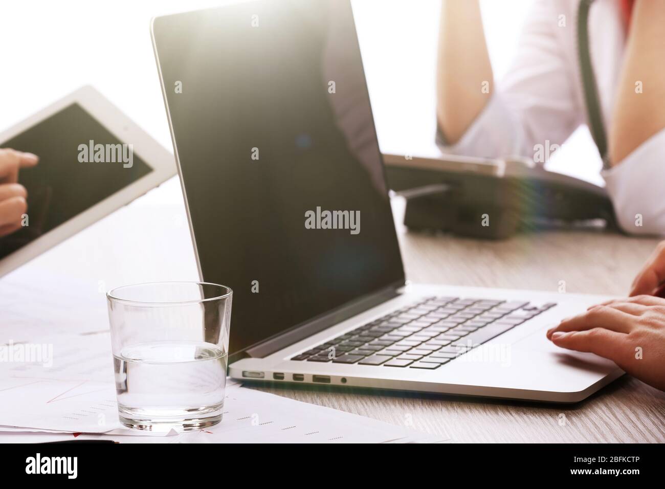 Working with laptop at worktable Stock Photo - Alamy