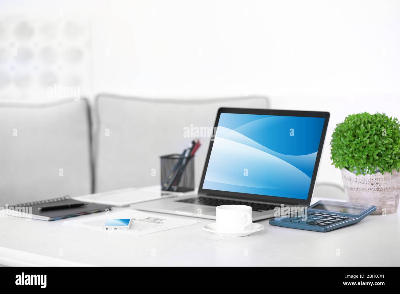 Modern workplace with laptop, close up Stock Photo - Alamy