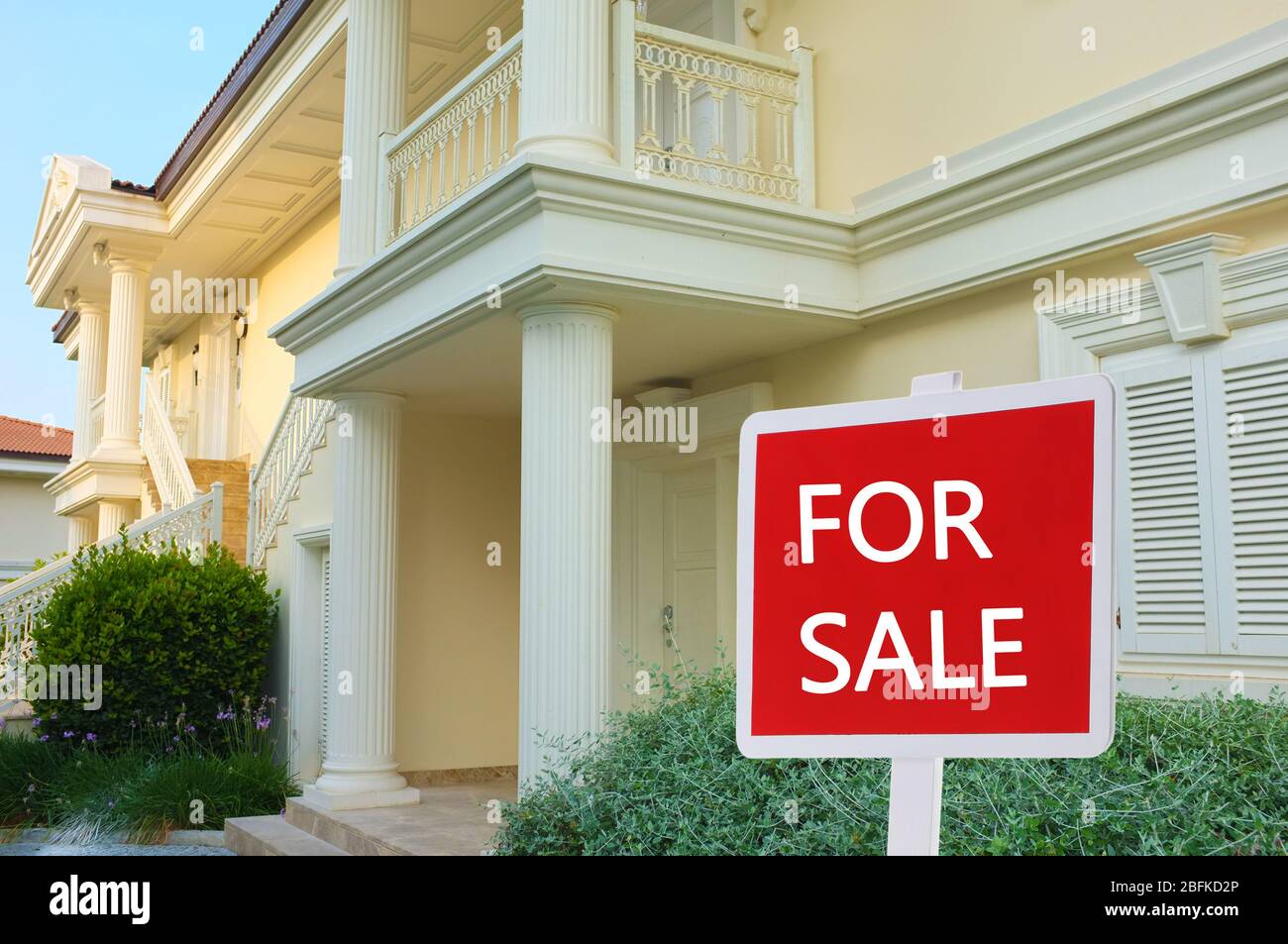 Real estate sign in front of new house for sale Stock Photo - Alamy