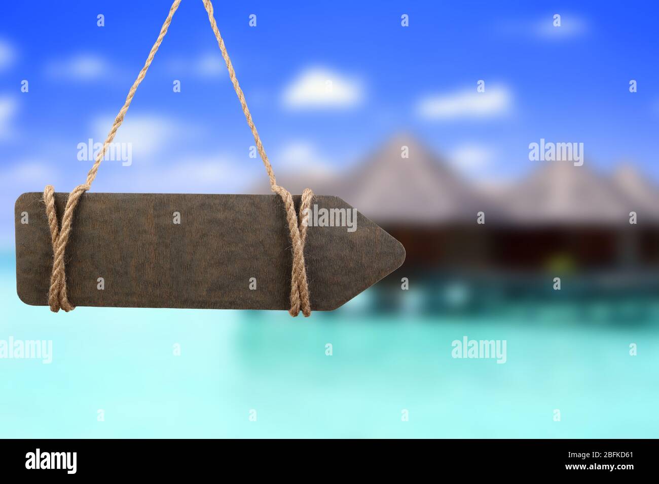 Wooden sign arrow on nature background Stock Photo - Alamy