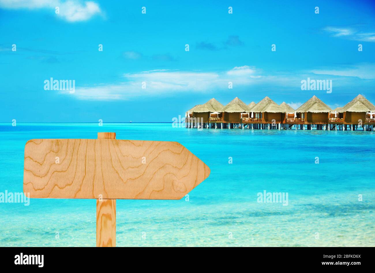 Wooden sign arrow on nature background Stock Photo - Alamy