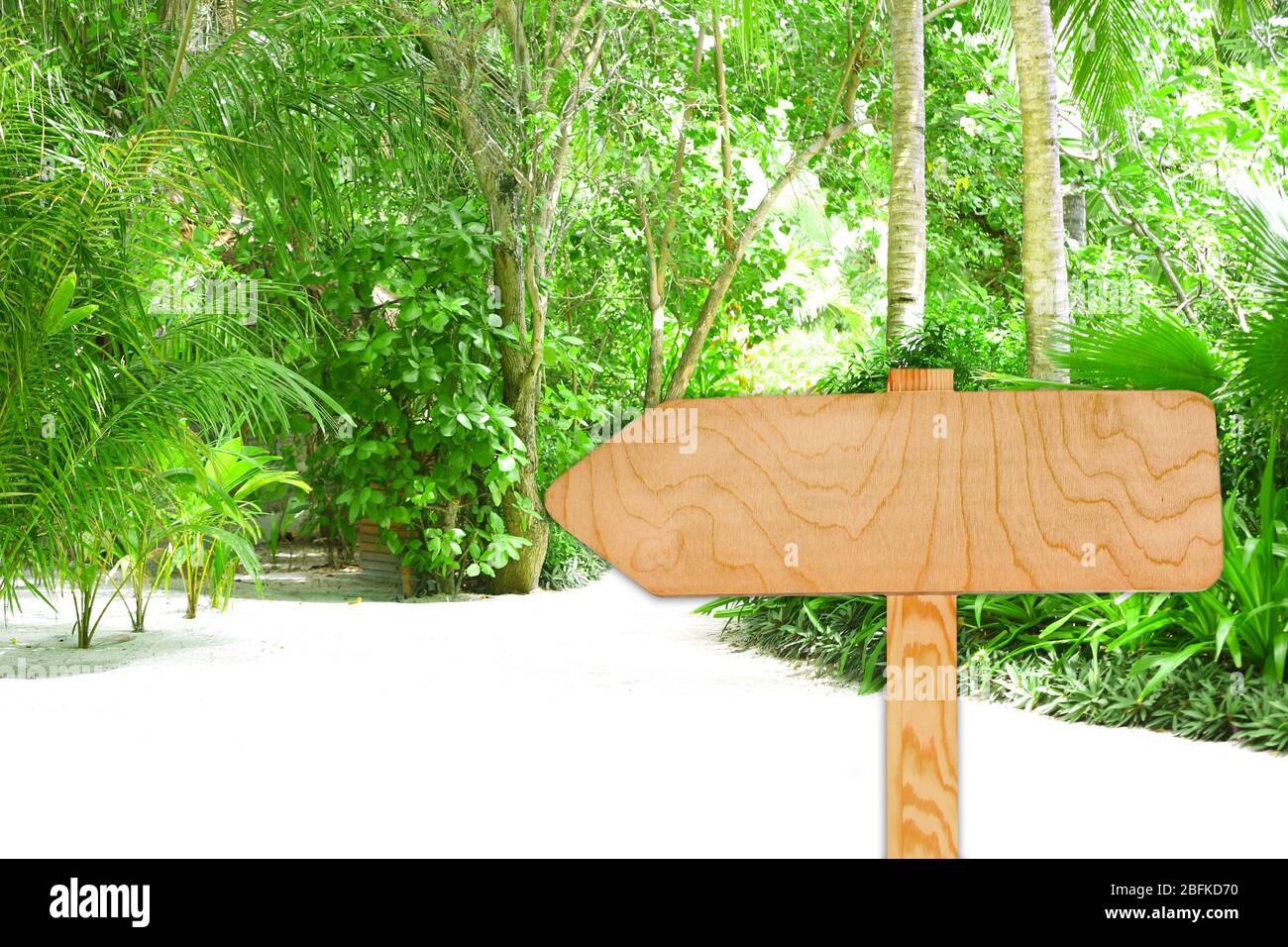 Wooden sign arrow on nature background Stock Photo - Alamy