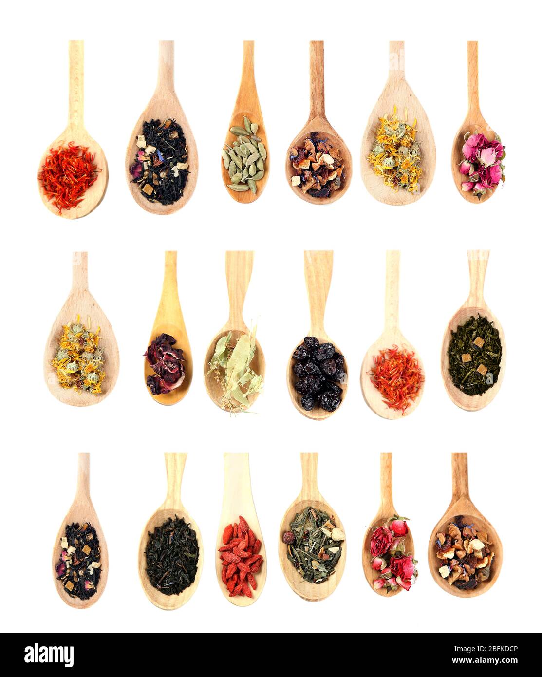 Collection of tea and natural additives in wooden spoons, isolated on ...
