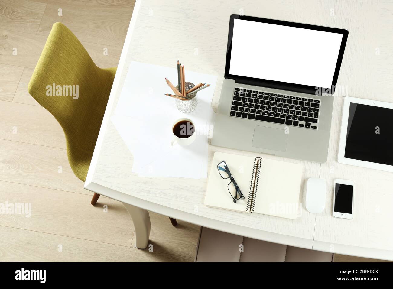 Workplace with laptop in room Stock Photo - Alamy