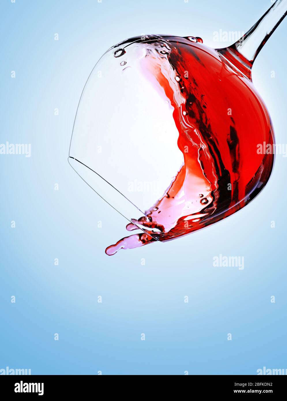 Falling glass of red wine Stock Photo - Alamy