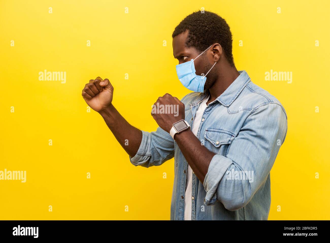 Side view portrait of confident man with surgical medical mask standing ...