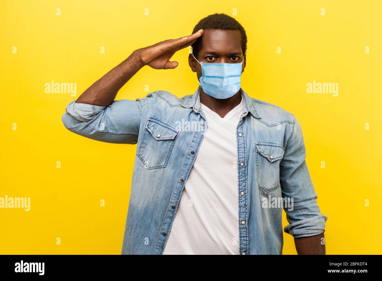 Yes sir! Portrait of serious confident man in denim casual shirt with ...