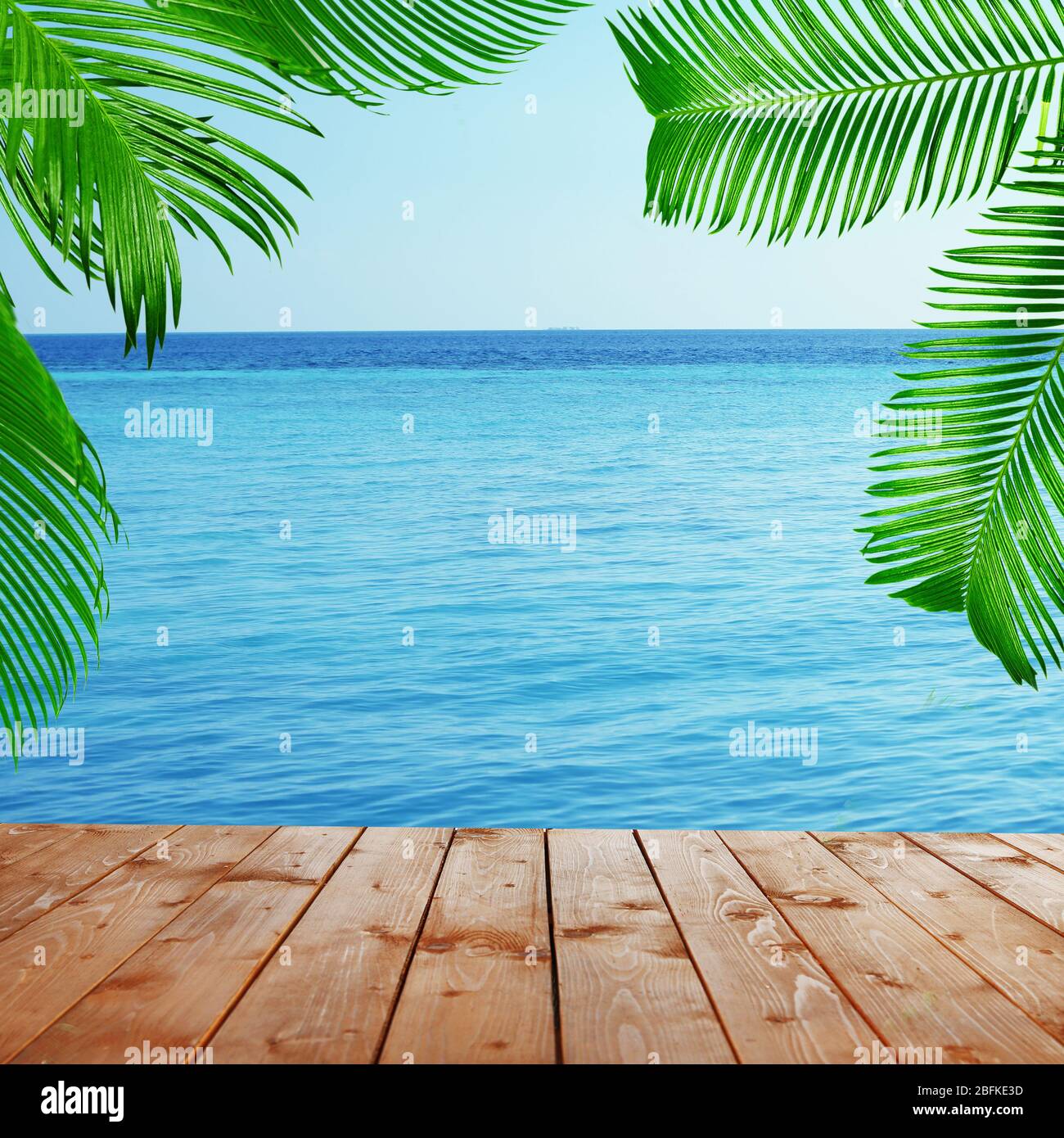 Wooden table with tropical paradise background Stock Photo - Alamy