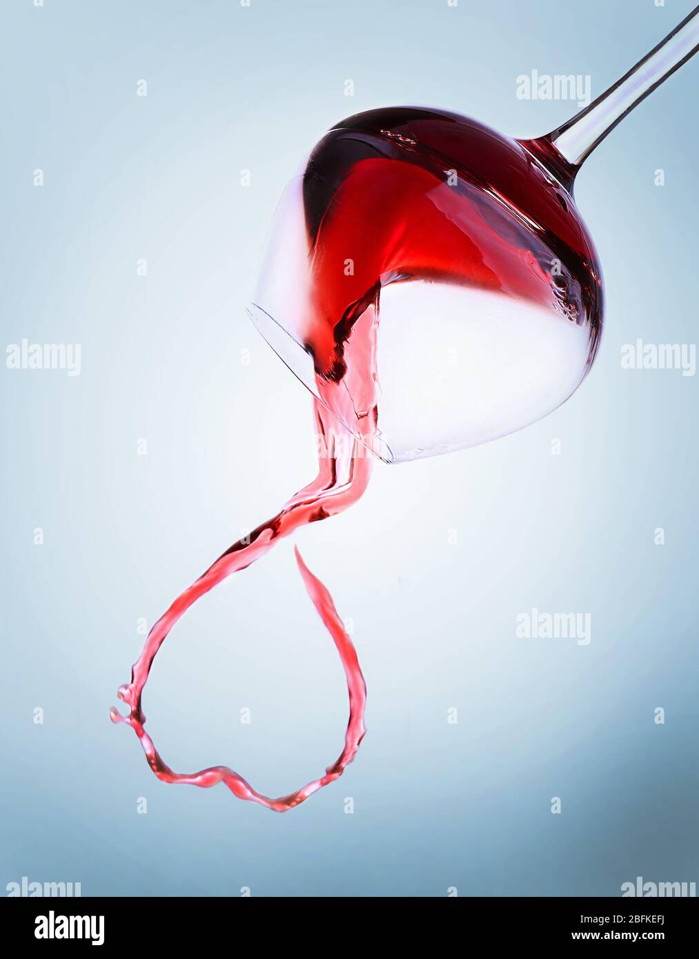 Falling glass of red wine Stock Photo - Alamy