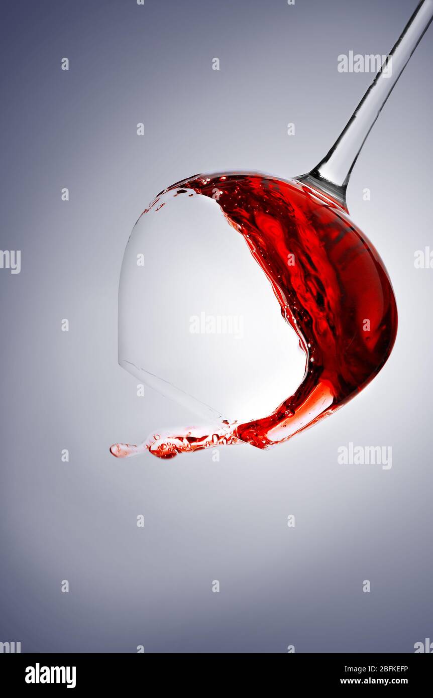 Falling glass of red wine Stock Photo - Alamy