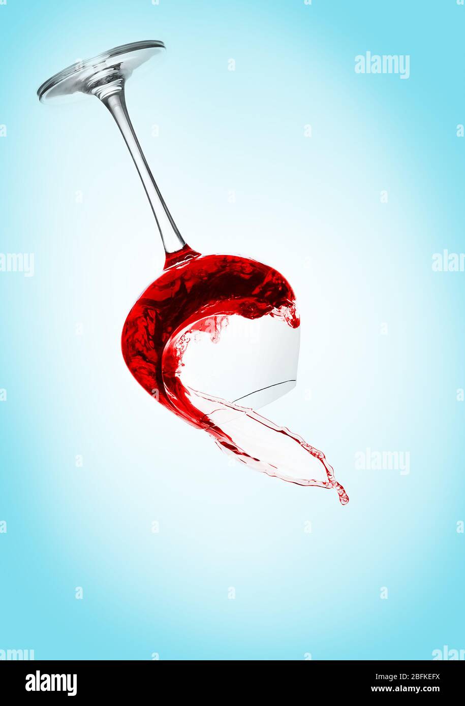 Falling glass of red wine Stock Photo - Alamy