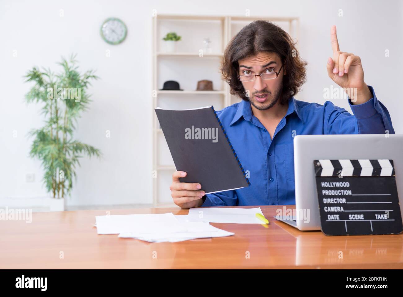 Movie director working in studio Stock Photo - Alamy