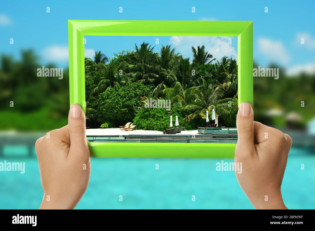 Woman hands holding empty frame on nature background Stock Photo - Alamy
