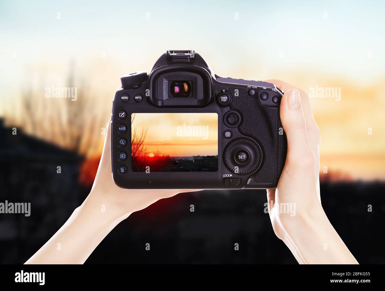 Photographer with camera at work Stock Photo - Alamy