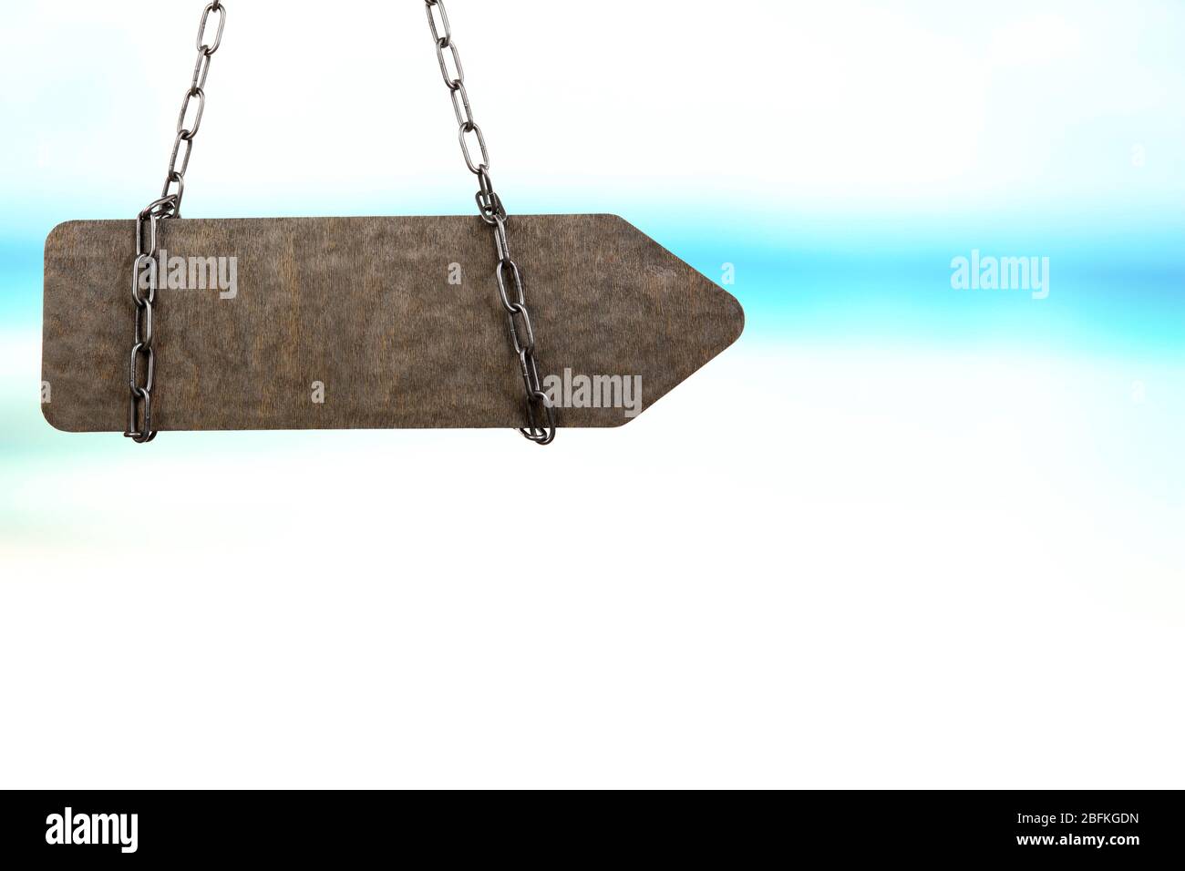 Wooden sign arrow on nature background Stock Photo - Alamy