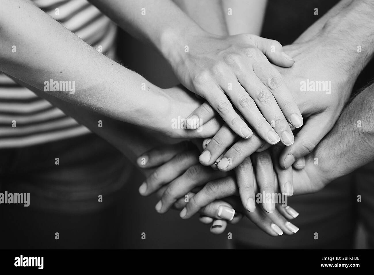 United hands close up. Black and white retro stylization Stock Photo ...