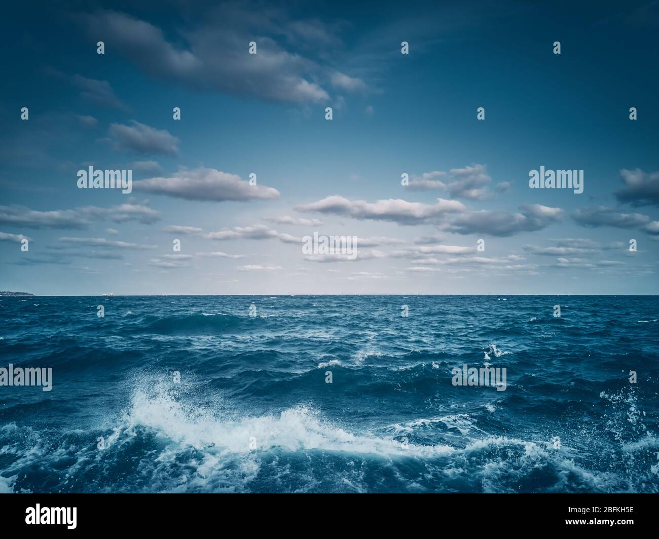 Waves amd sea ripple water with blue clody sky Stock Photo - Alamy