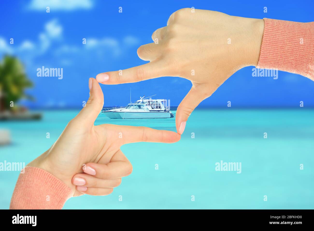 Woman holds hands in the shape of a frame on nature background Stock ...