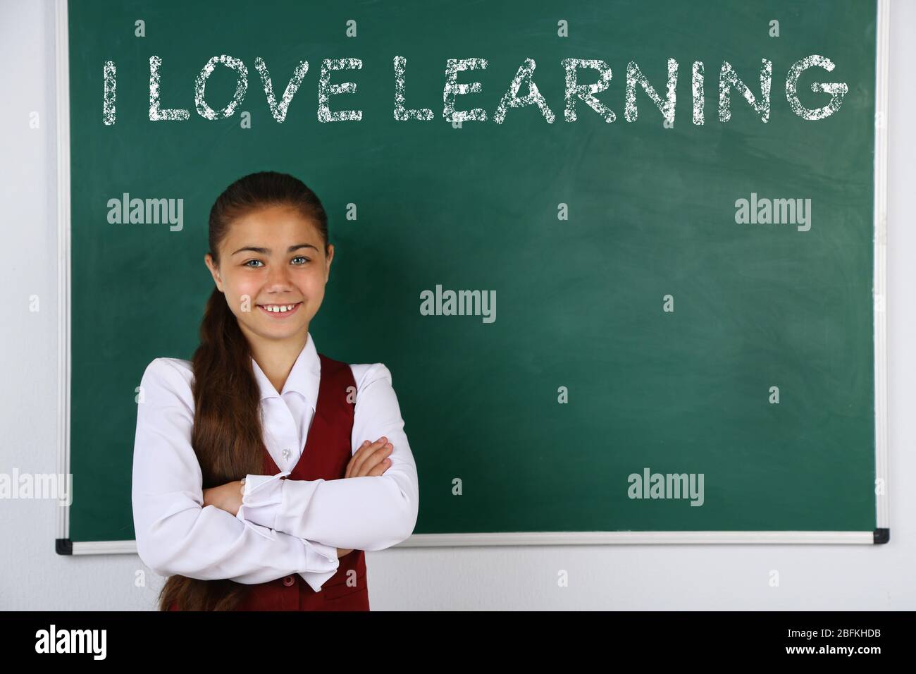 Cheerful girl at the blackboard. I love learning concept Stock Photo ...