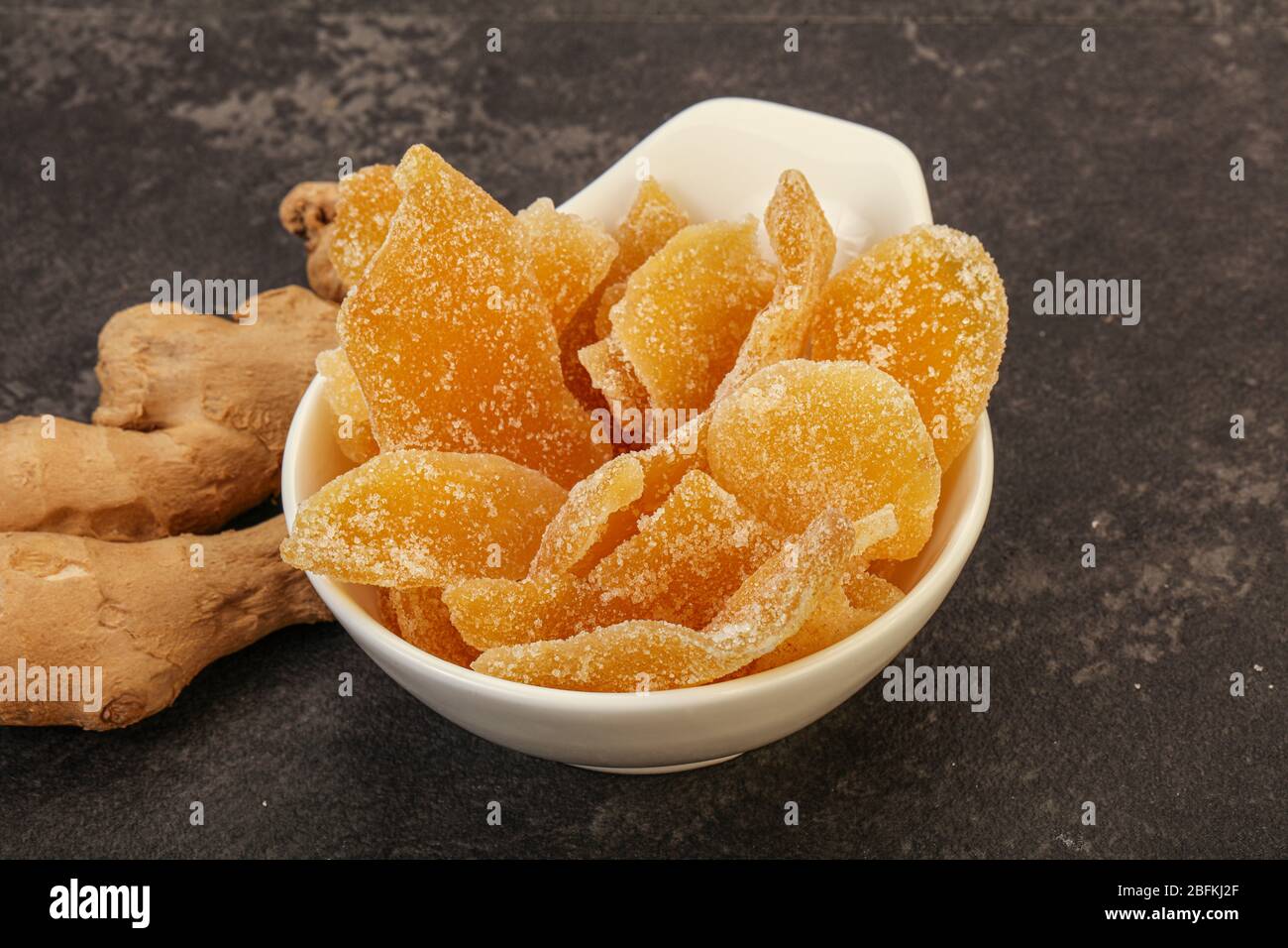 Dry sweet ginger snack in the bowl Stock Photo - Alamy