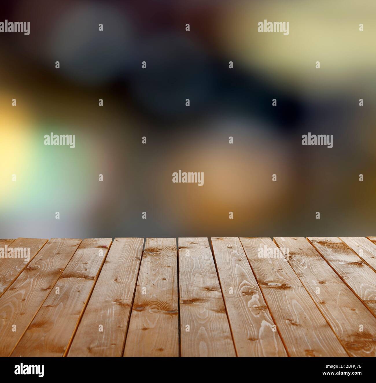 Wooden table with abstract blur background Stock Photo - Alamy