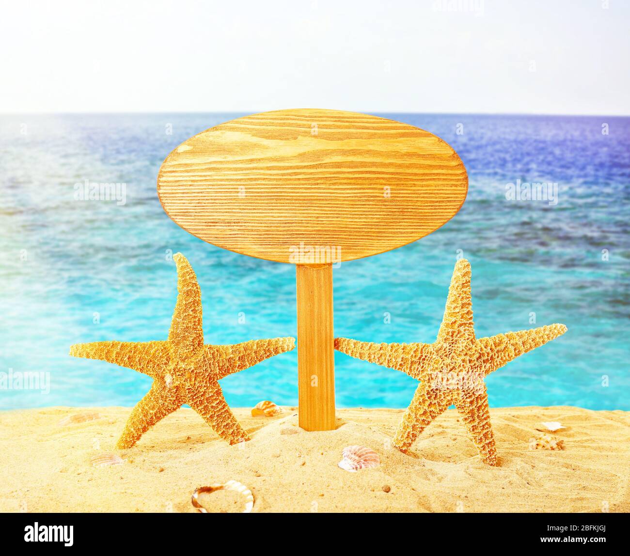 Wooden signboard on the sea background Stock Photo - Alamy