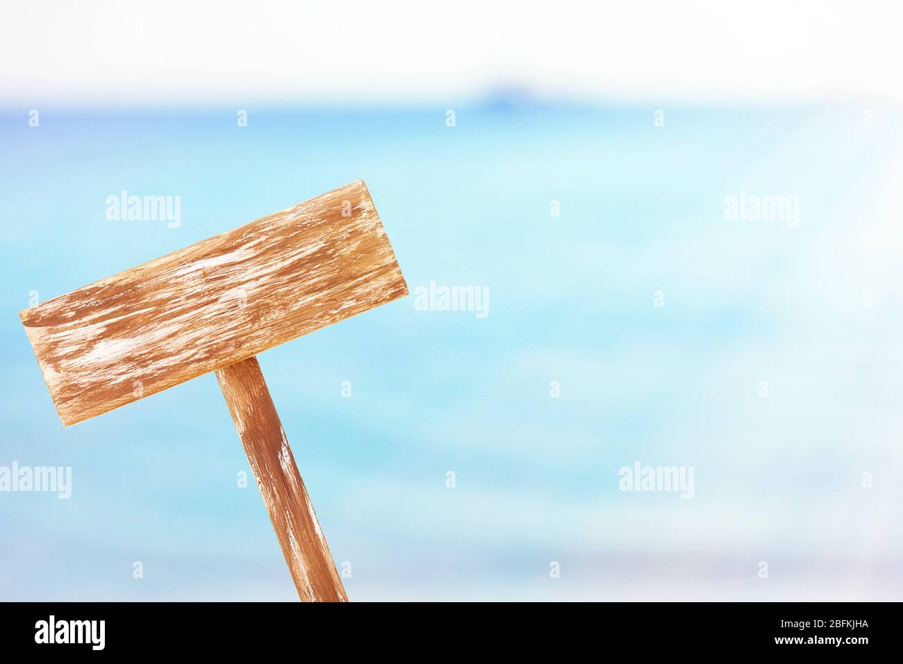 Wooden signboard on the sea background Stock Photo - Alamy