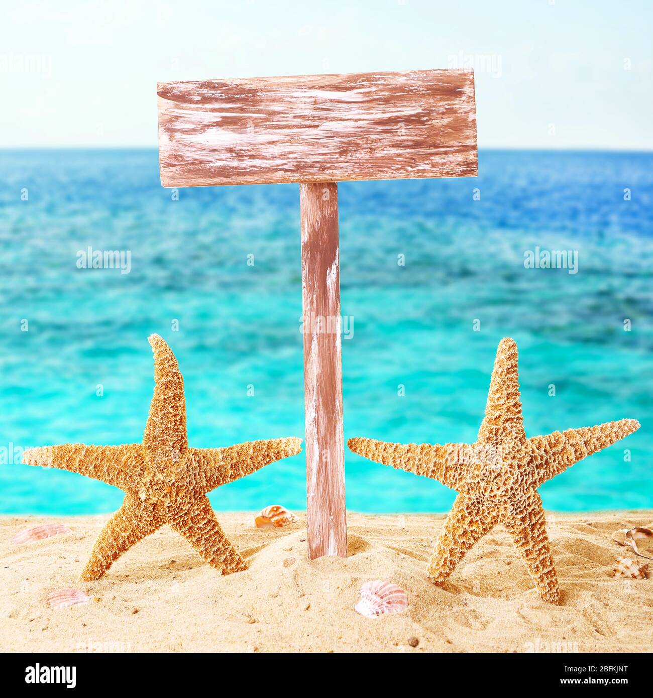Wooden signboard on the sea background Stock Photo - Alamy