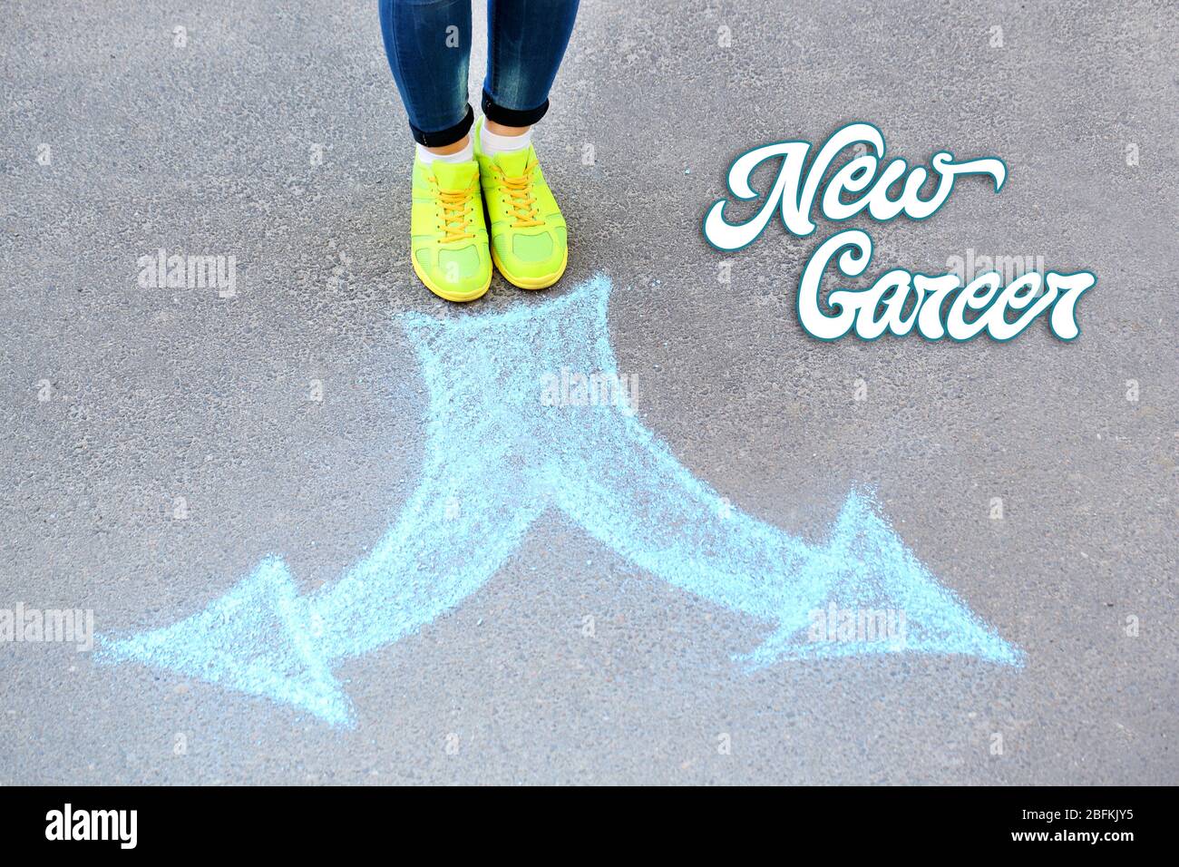 Dream job concept. Female feet and drawing arrows on pavement ...