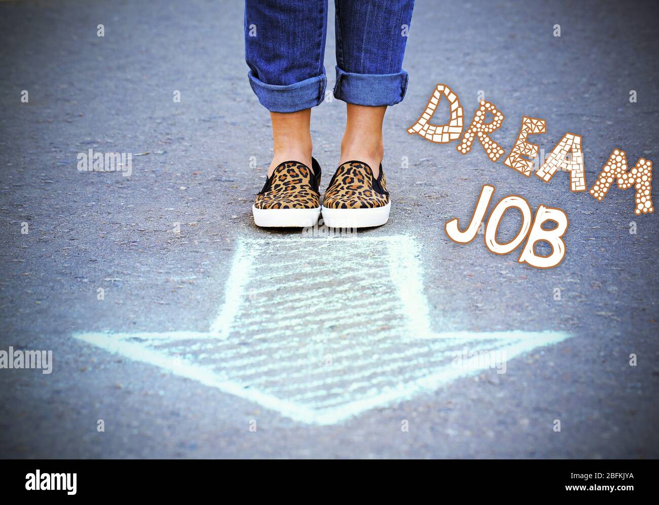 Dream job concept. Female feet and drawing arrows on pavement ...