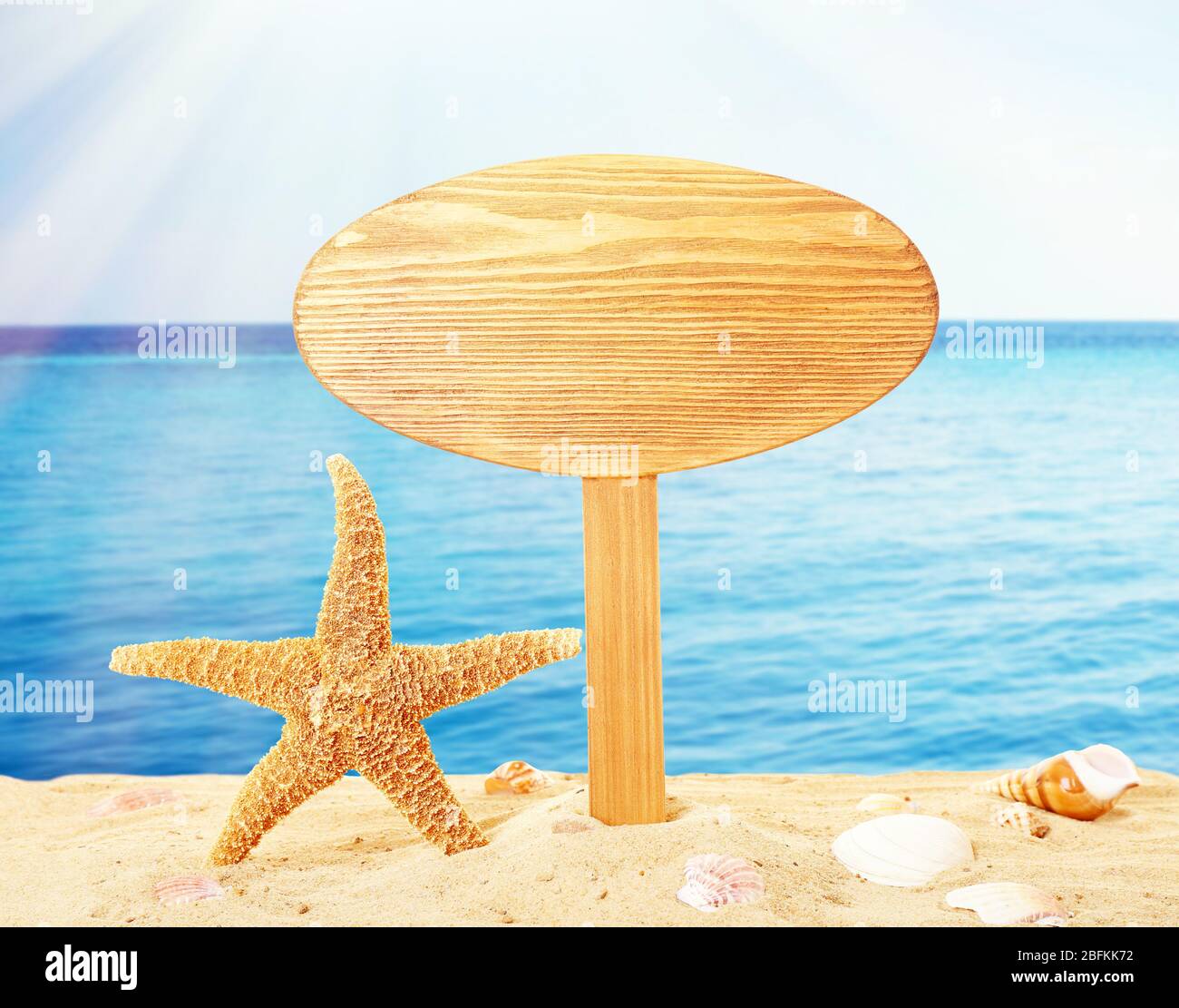 Wooden signboard on the sea background Stock Photo - Alamy