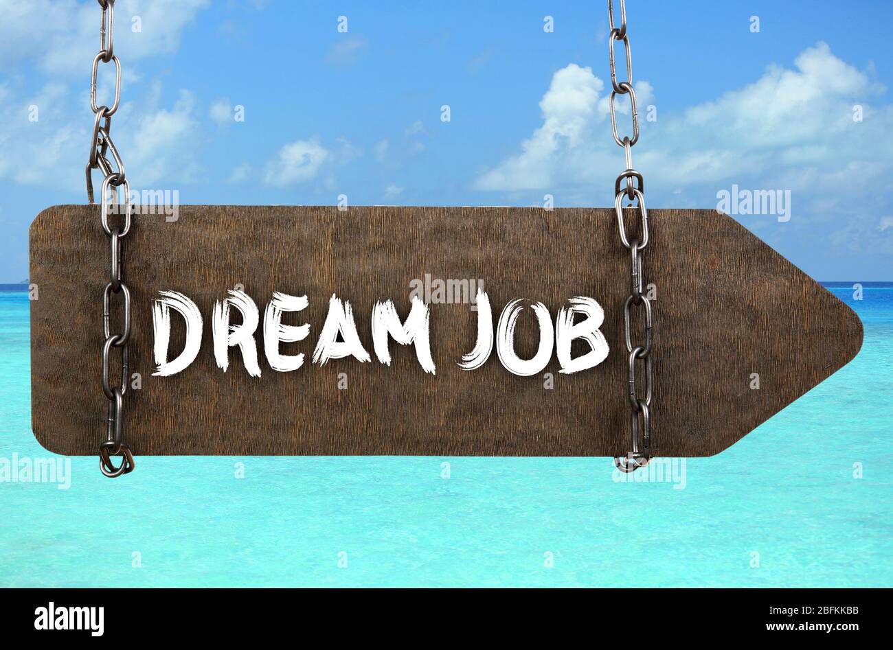 Dream job concept.Wooden sign arrow on sea background Stock Photo - Alamy