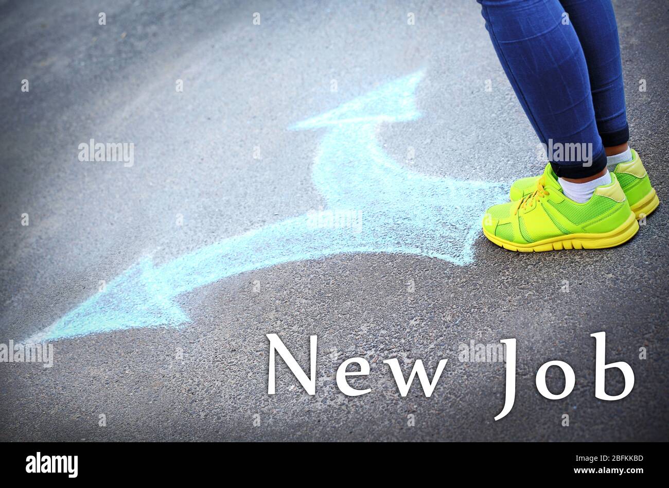 Dream job concept. Female feet and drawing arrows on pavement ...