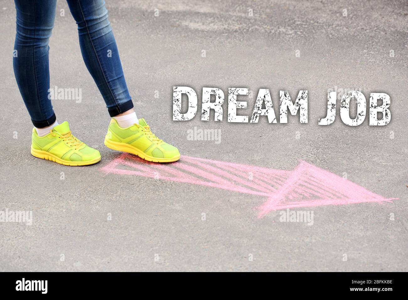 Dream job concept. Female feet and drawing arrow on pavement background ...