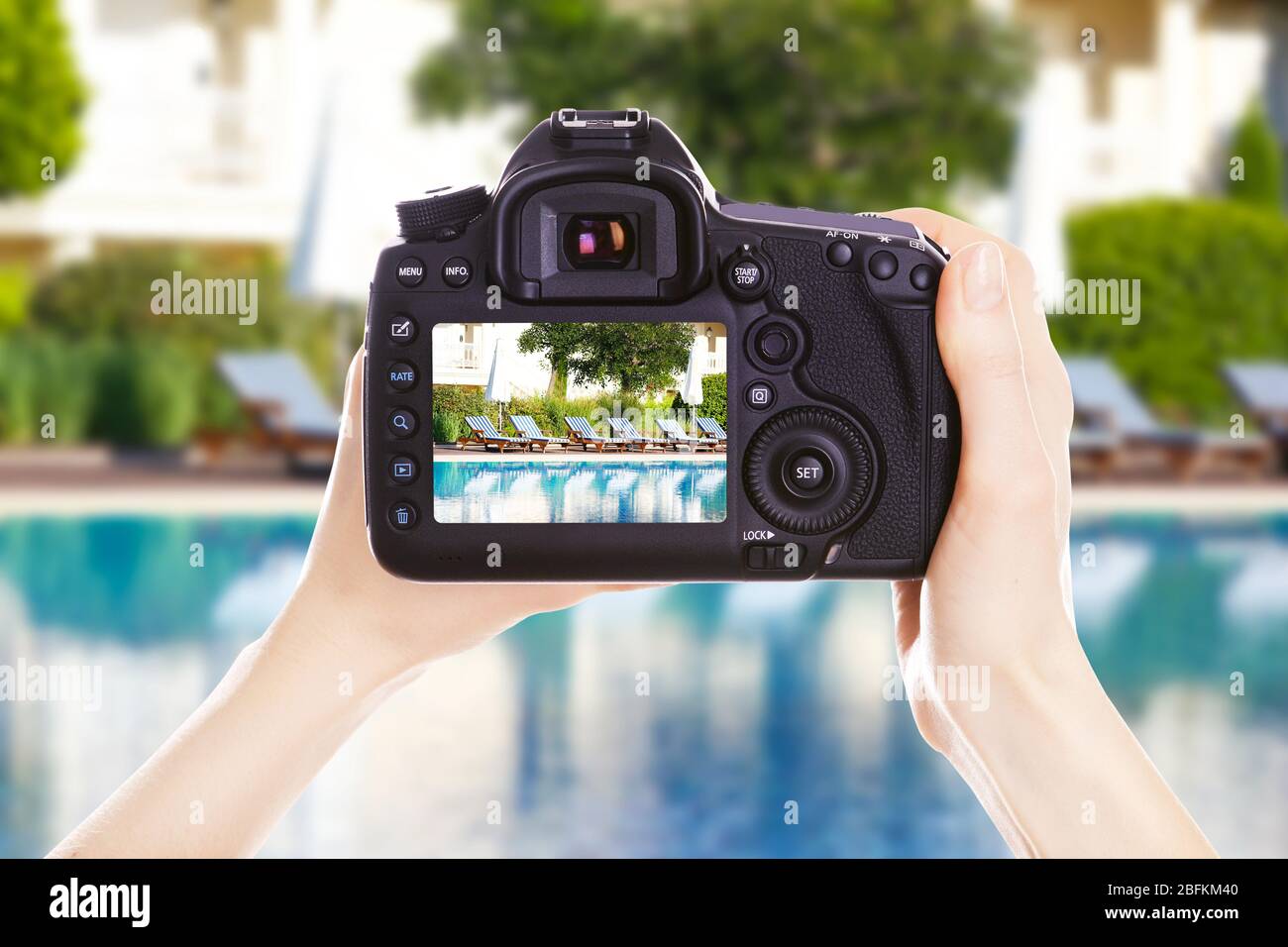 Photographer with camera at work Stock Photo - Alamy