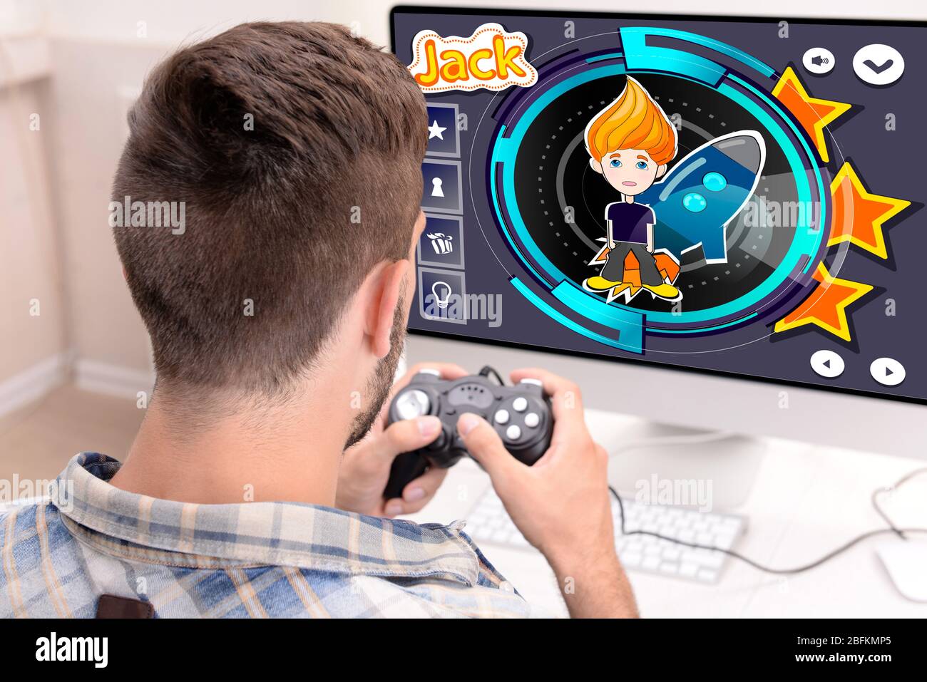 Young man playing computer games at home Stock Photo - Alamy